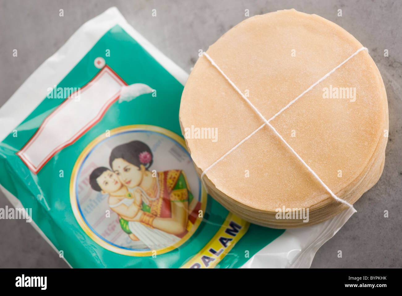 Fresh package of uncooked papadum Stock Photo - Alamy