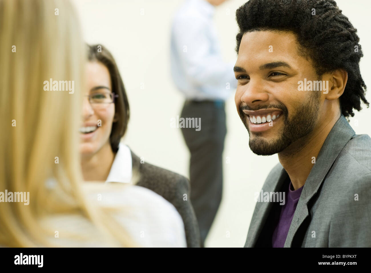 Executive laughing with colleagues Stock Photo - Alamy