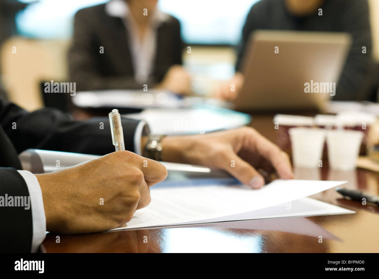 Executive signing document, cropped Stock Photo - Alamy