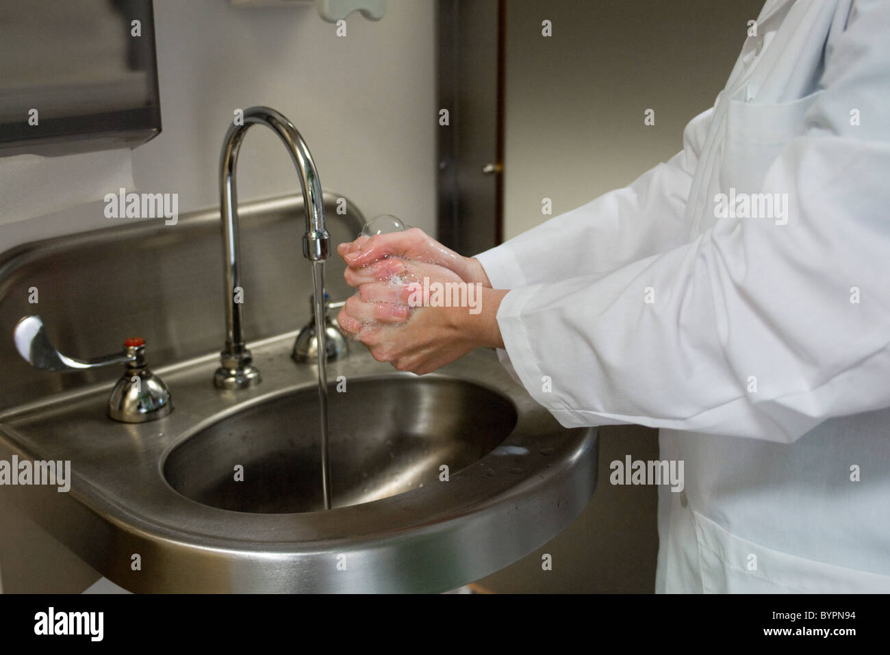 Healthcare professional washing hands, cropped Stock Photo - Alamy