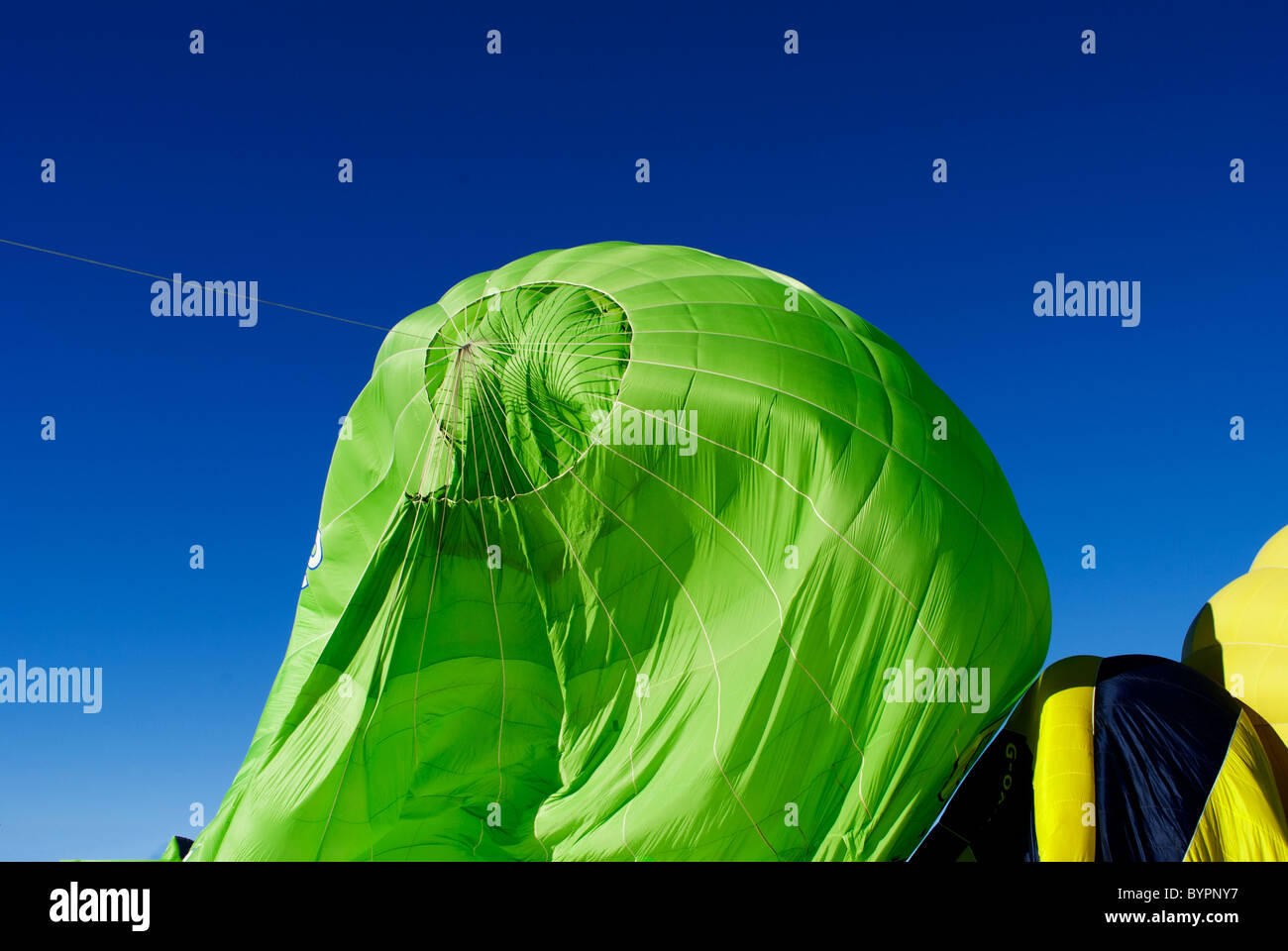 balloon green during the hot air heating Stock Photo - Alamy