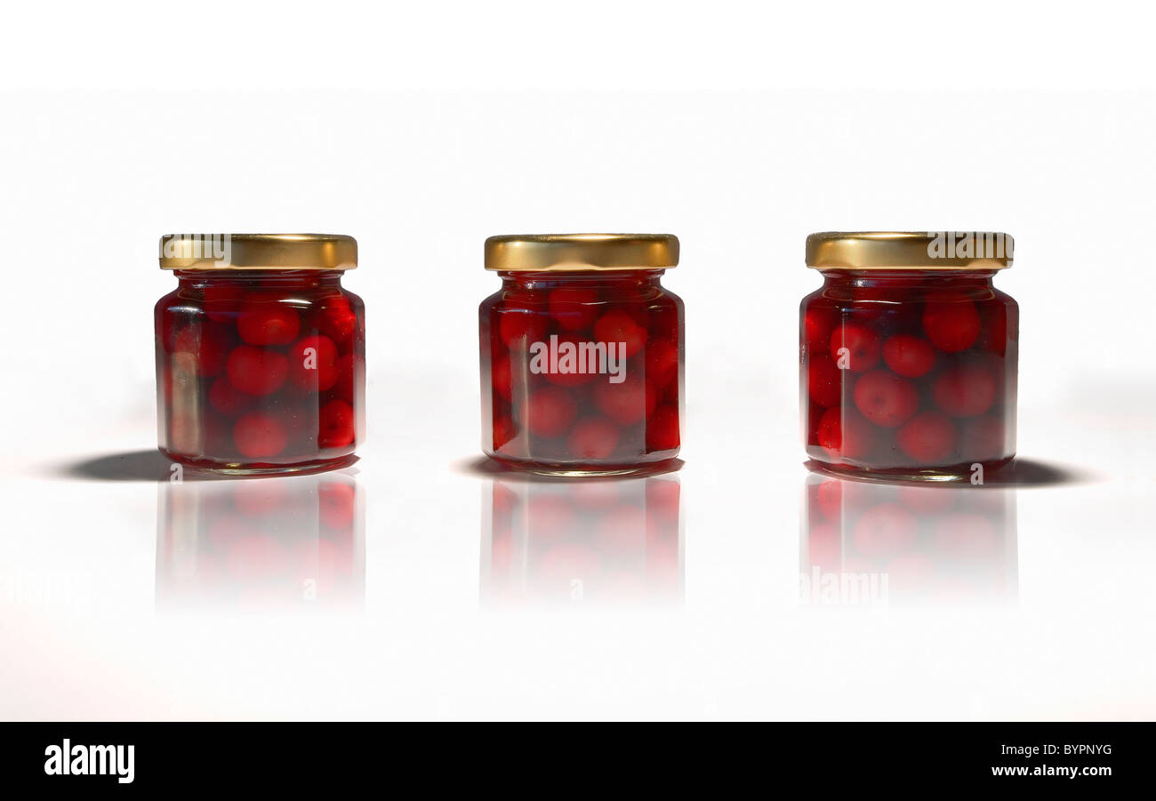 Three bottles of red cherries Stock Photo - Alamy