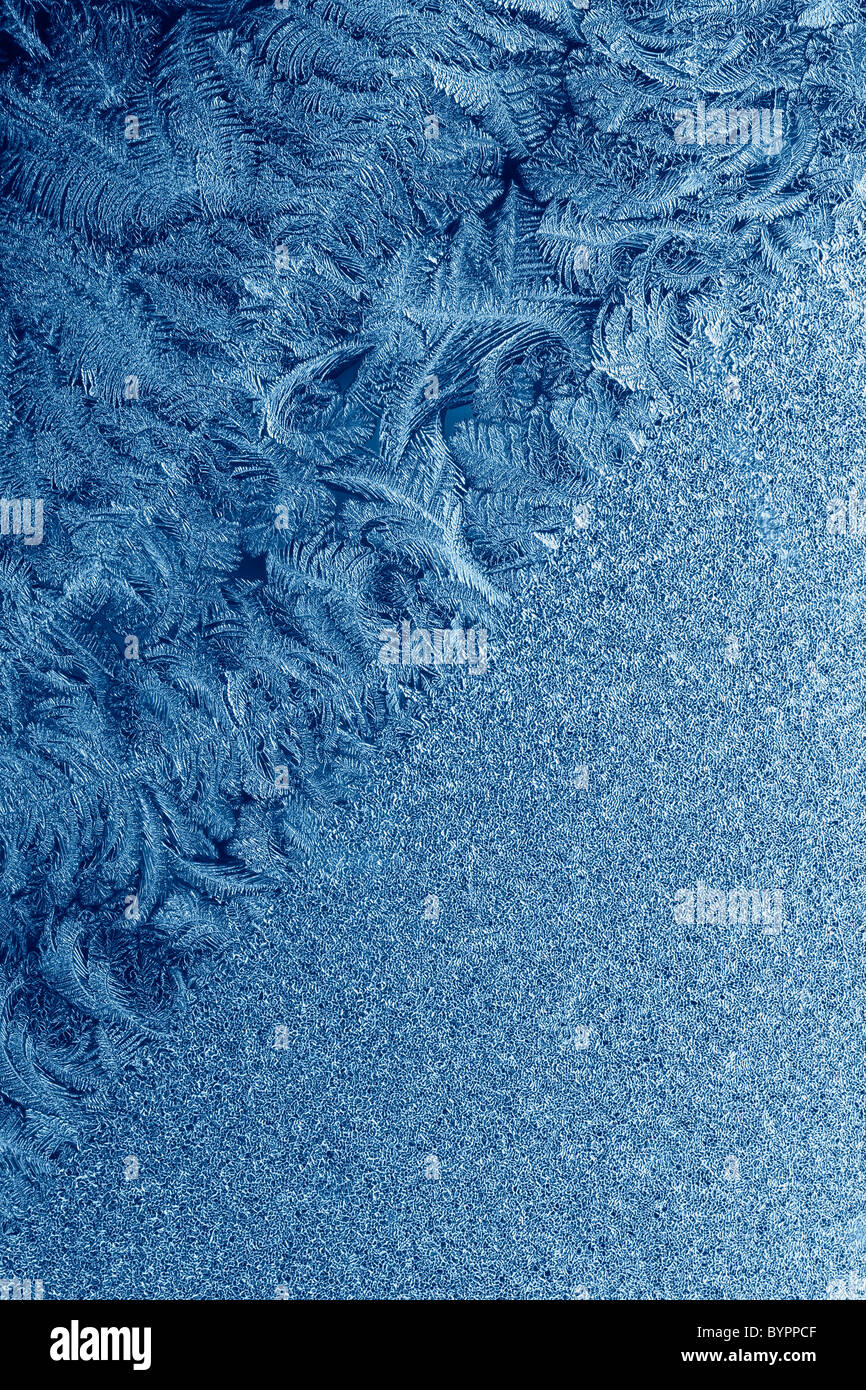 Frost patterns on window glass in winter Stock Photo - Alamy