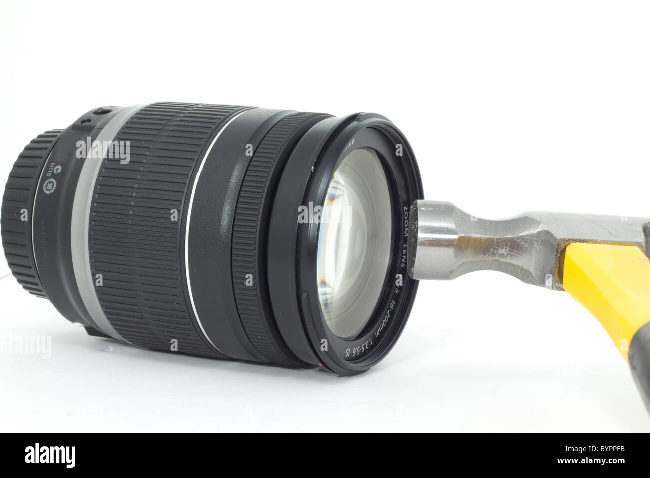A hammer about to smash a delicate expensive camera lens Stock Photo ...