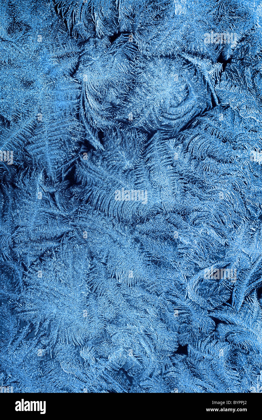 Frost patterns on window glass in winter Stock Photo - Alamy