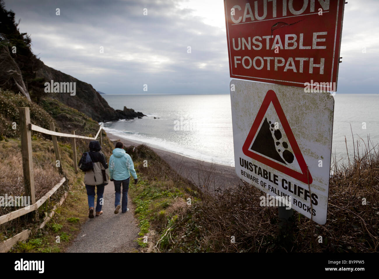 People Walking Past Warning Sign High Resolution Stock Photography and ...