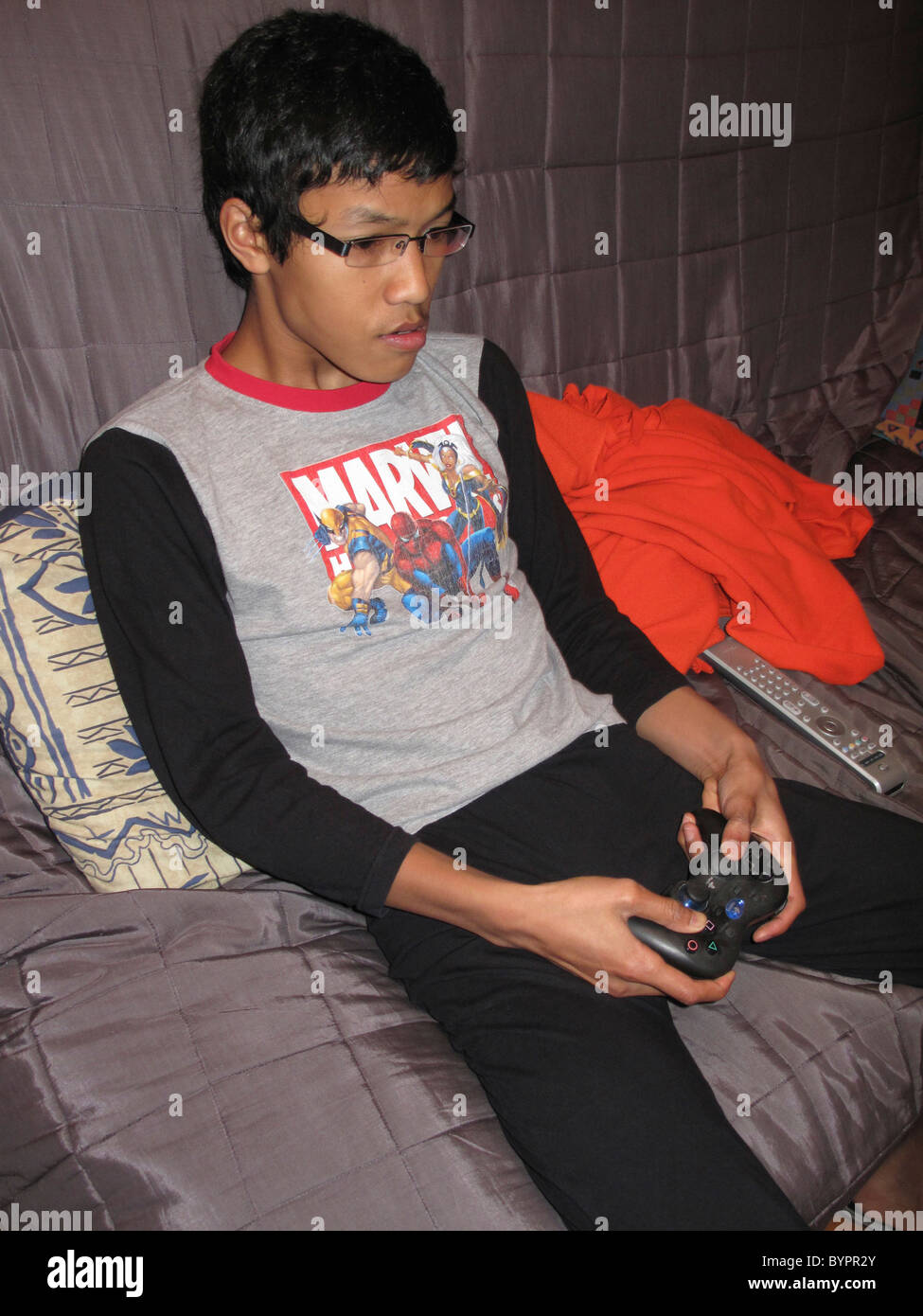 boy playing with video game, sony PS3 Stock Photo - Alamy