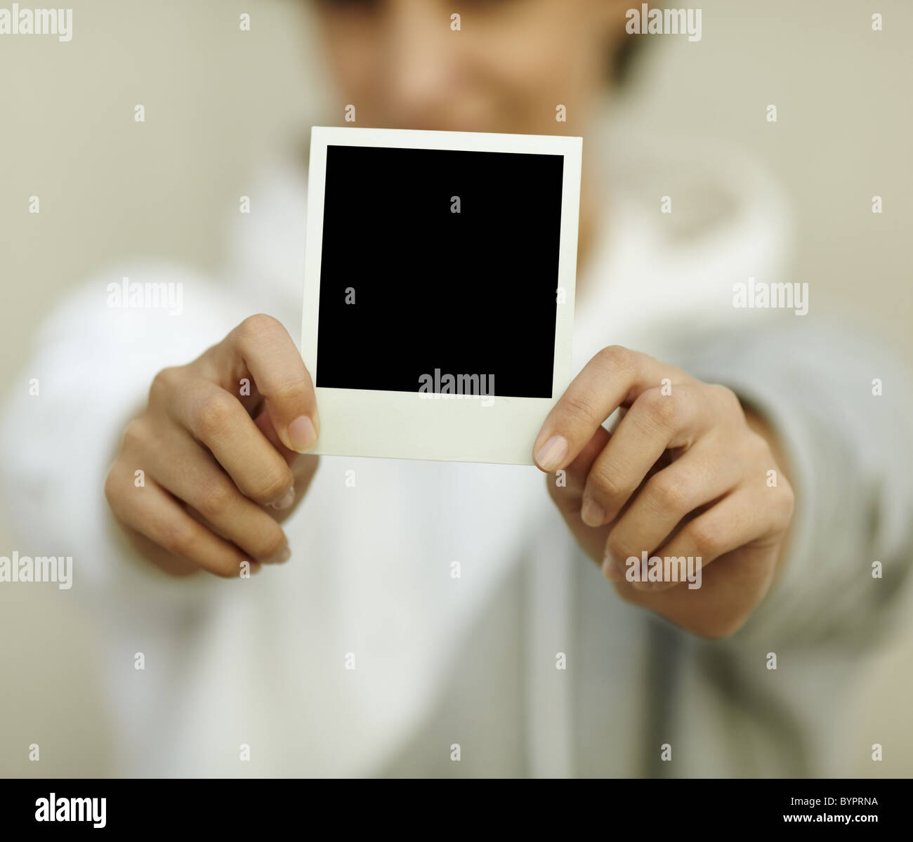 young woman hold photo Stock Photo - Alamy
