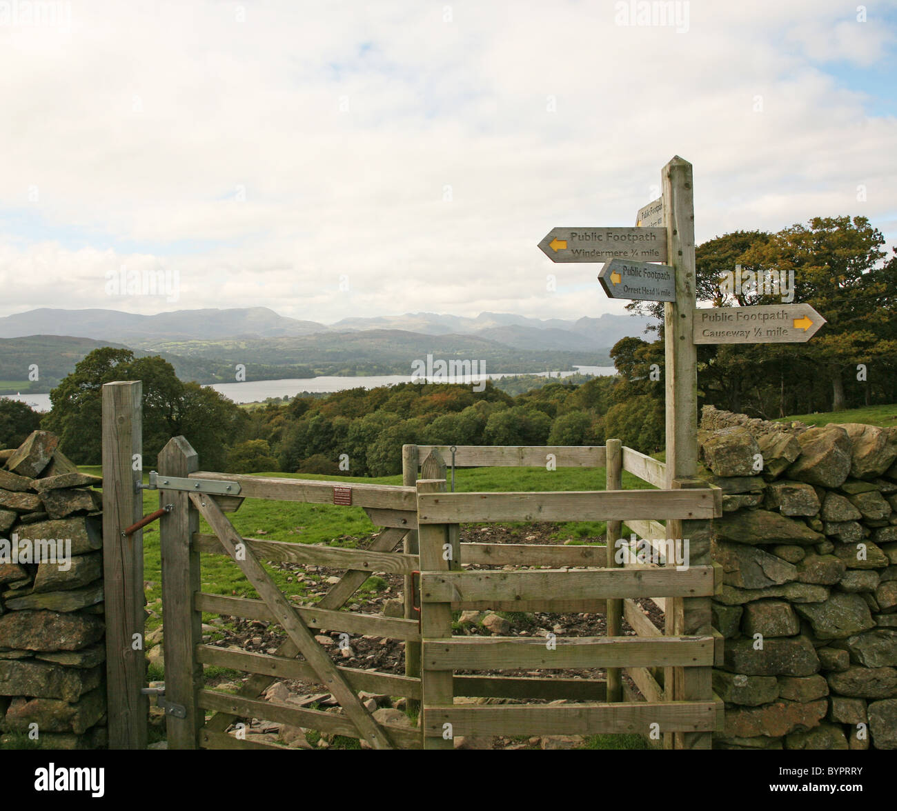 wooden signpost overlooking lake Windermere English Lake District ...