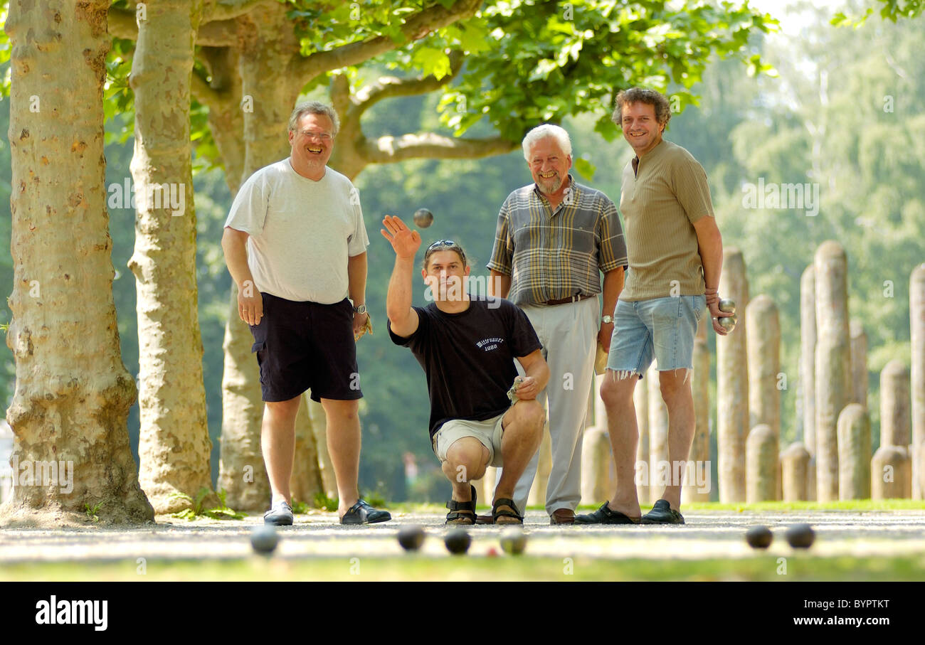 four men playing boule, petanque Stock Photo - Alamy