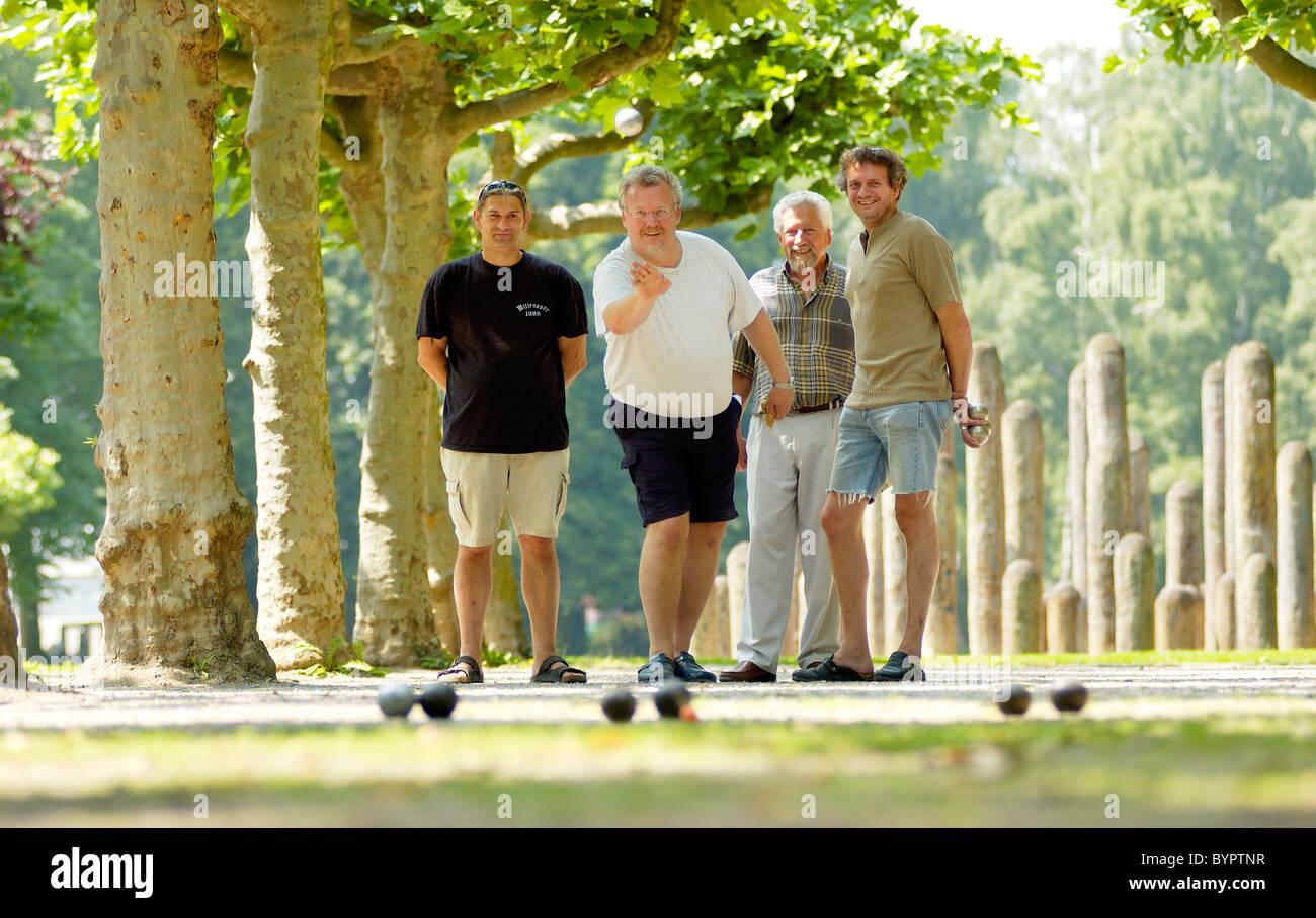 four men playing boule, petanque Stock Photo - Alamy