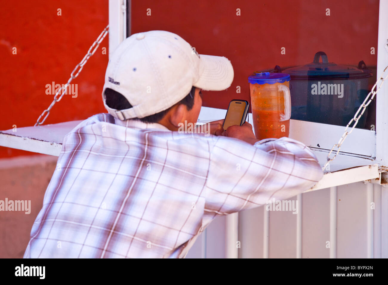 Mexican using cellphone hi-res stock photography and images - Alamy