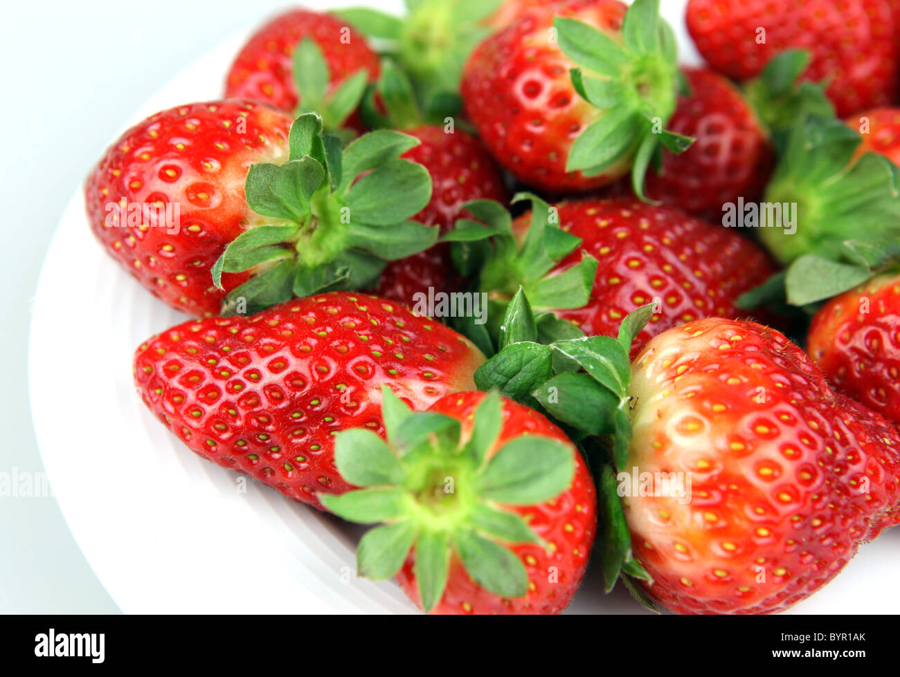 Group of bright red shiny strawberries hi-res stock photography and ...