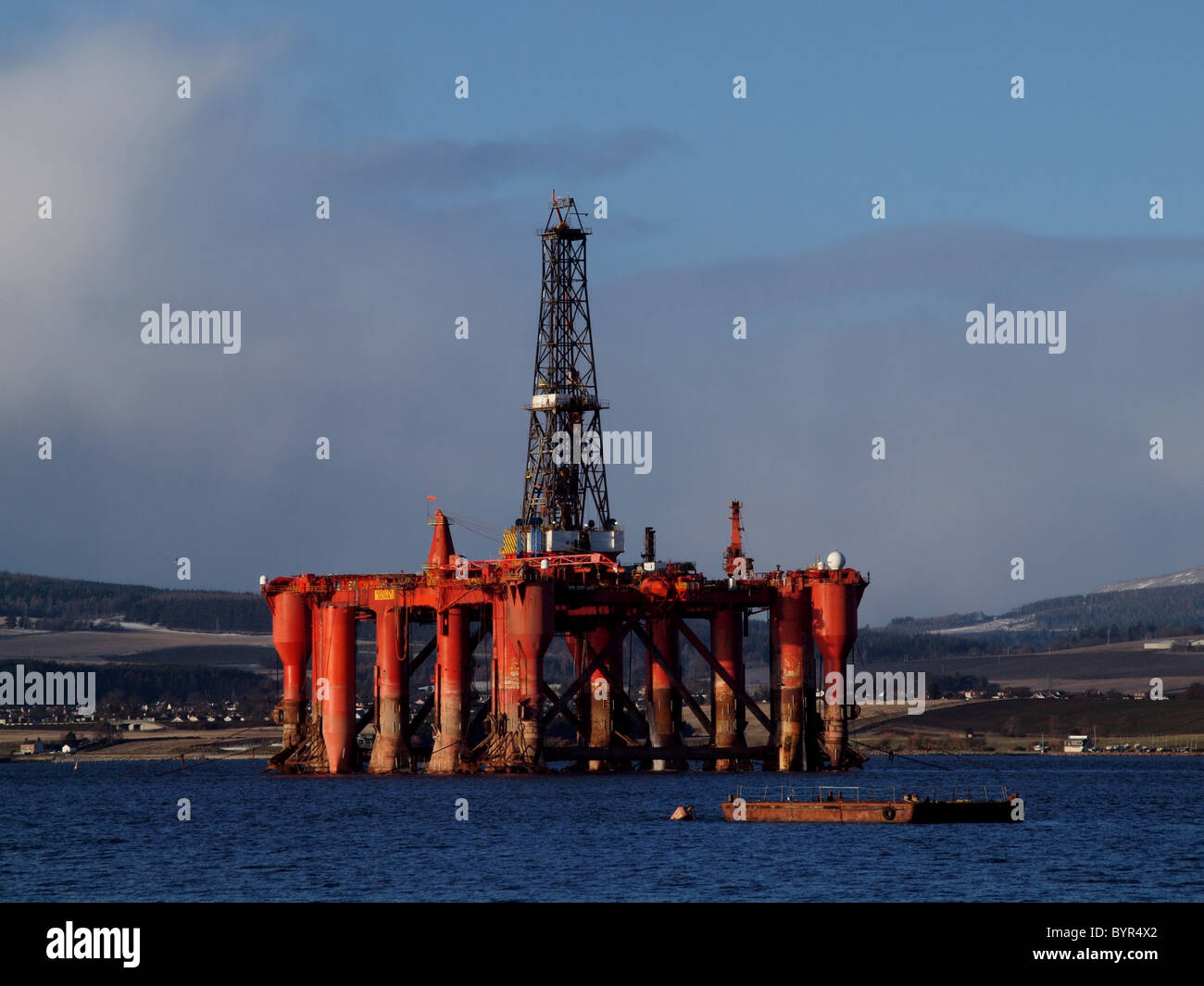 A semi submersible Oil Rig is moored alongside the dock at Invergordon ...