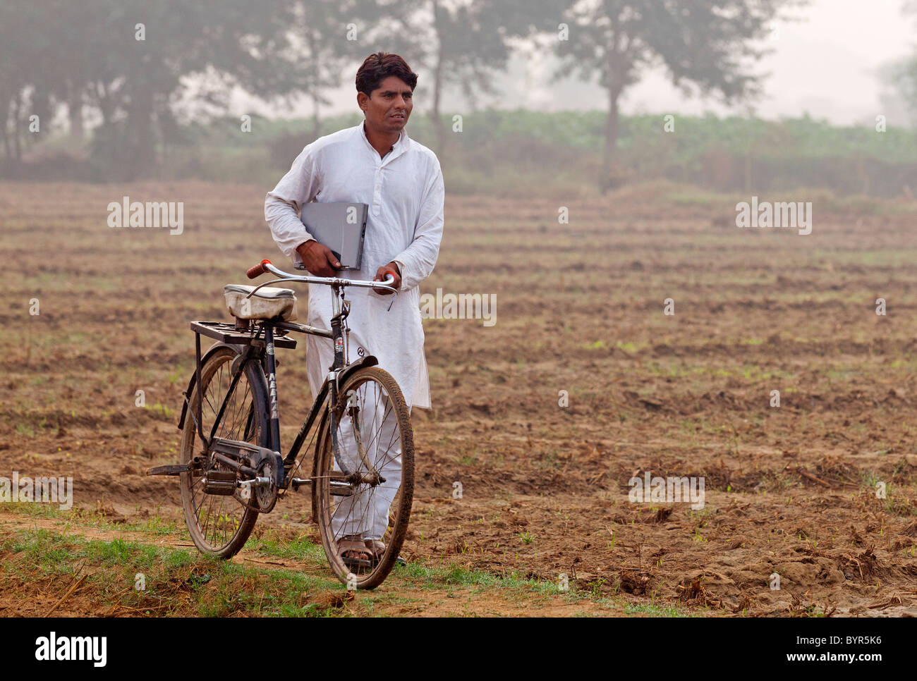 Indian Man Pushing Bike High Resolution Stock Photography and Images ...