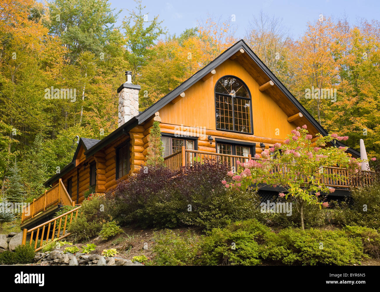 a log house surrounded by trees in autumn; quebec, canada Stock Photo ...