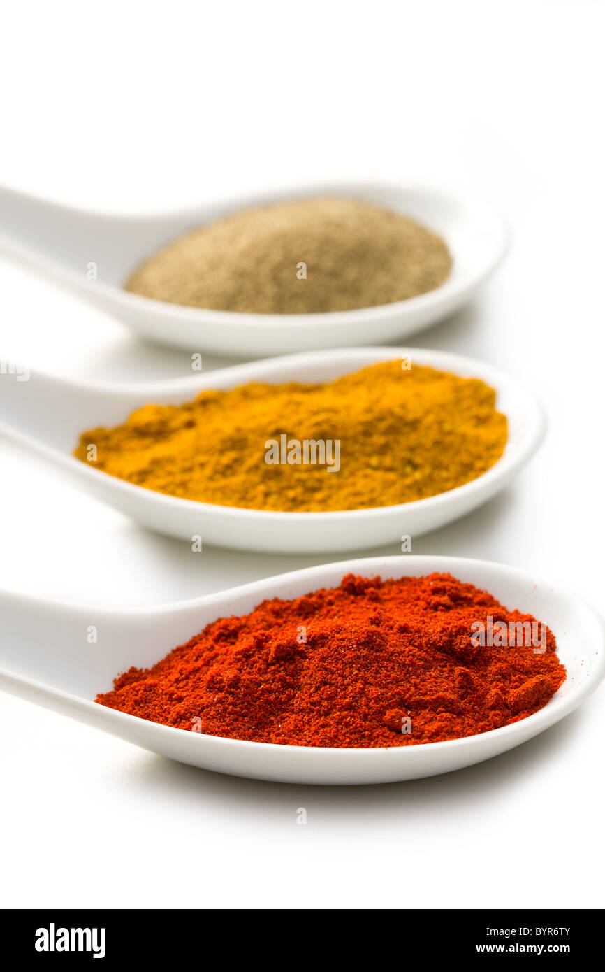 various spicy powder on white background Stock Photo - Alamy