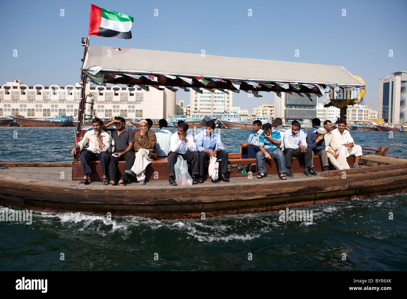 Abra carrying locals across The Creek in Dubai, UAE Stock Photo - Alamy