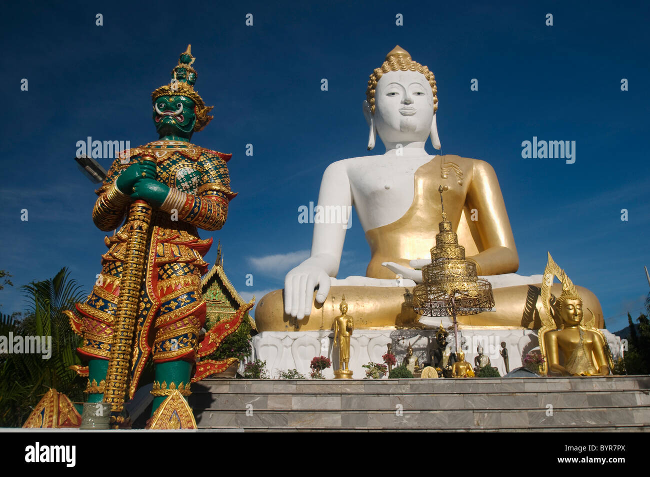 wat doi kham temple statue with guardian giant; chiang mai, thailand ...