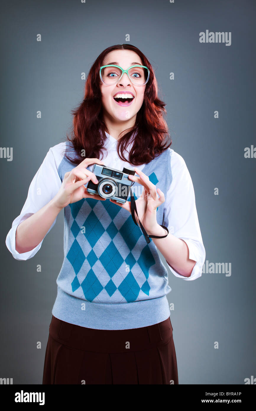 Geeky woman with camera Stock Photo - Alamy
