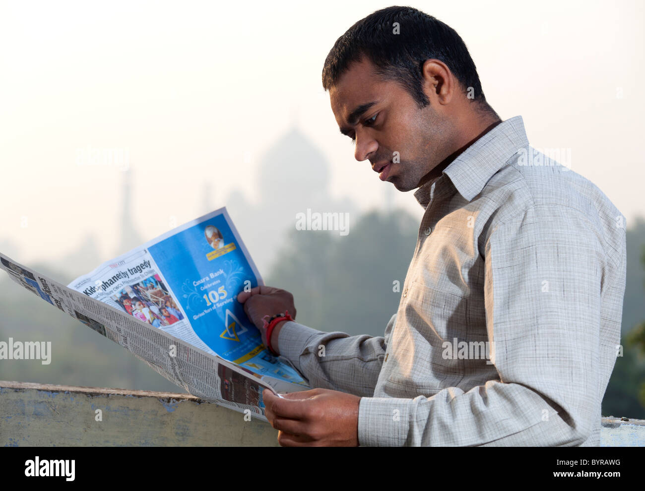 South indian man reading newspaper hi-res stock photography and images ...