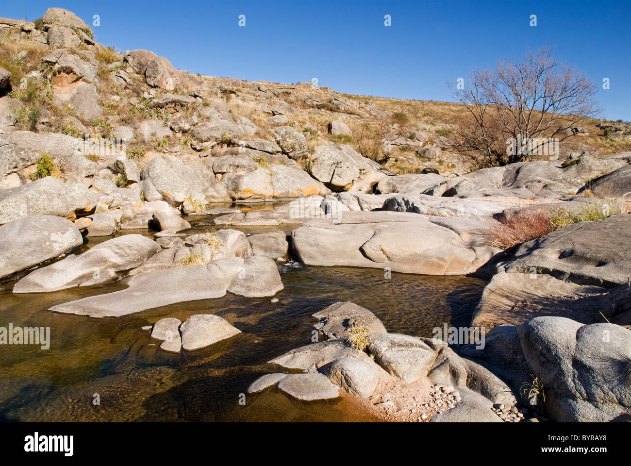stream surrounded by a rocky, dry terrain; cordoba, argentina Stock ...