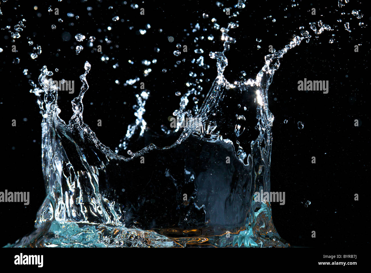 a drop of water landing and splashing Stock Photo - Alamy