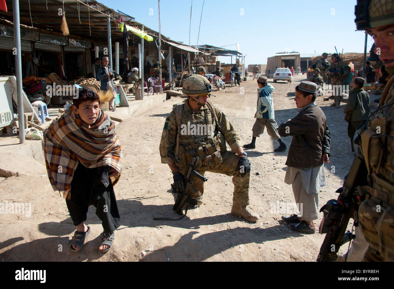 Soldiers on patrol in Helmand village Afghanistan Stock Photo - Alamy