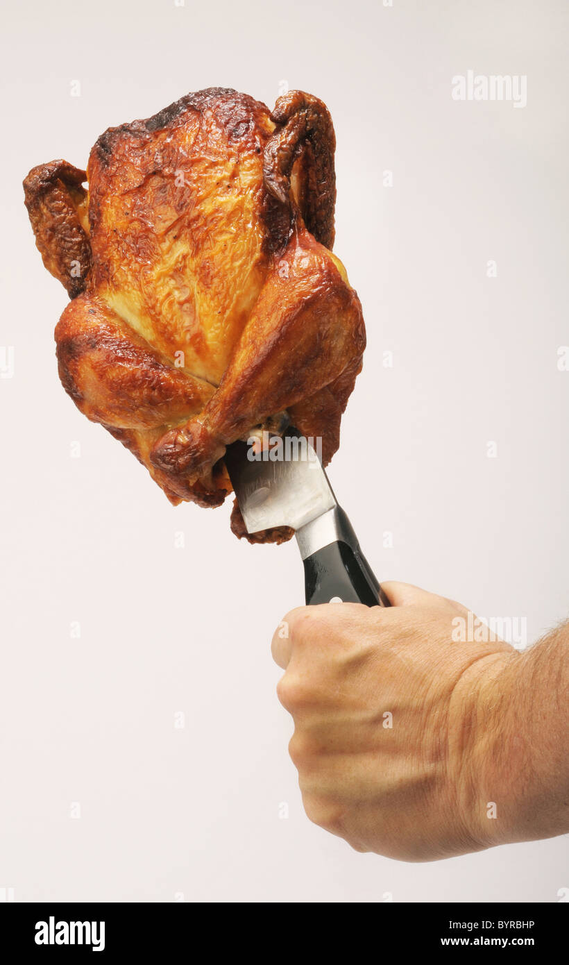 Roasted Chicken on a Knife Stock Photo - Alamy