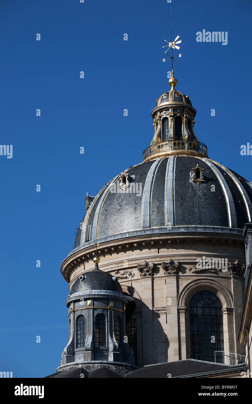 dome tower with gold trim against a blue sky; paris, france Stock Photo ...