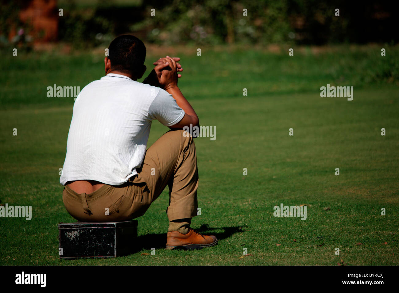 A soldier waiting on a box Stock Photo - Alamy