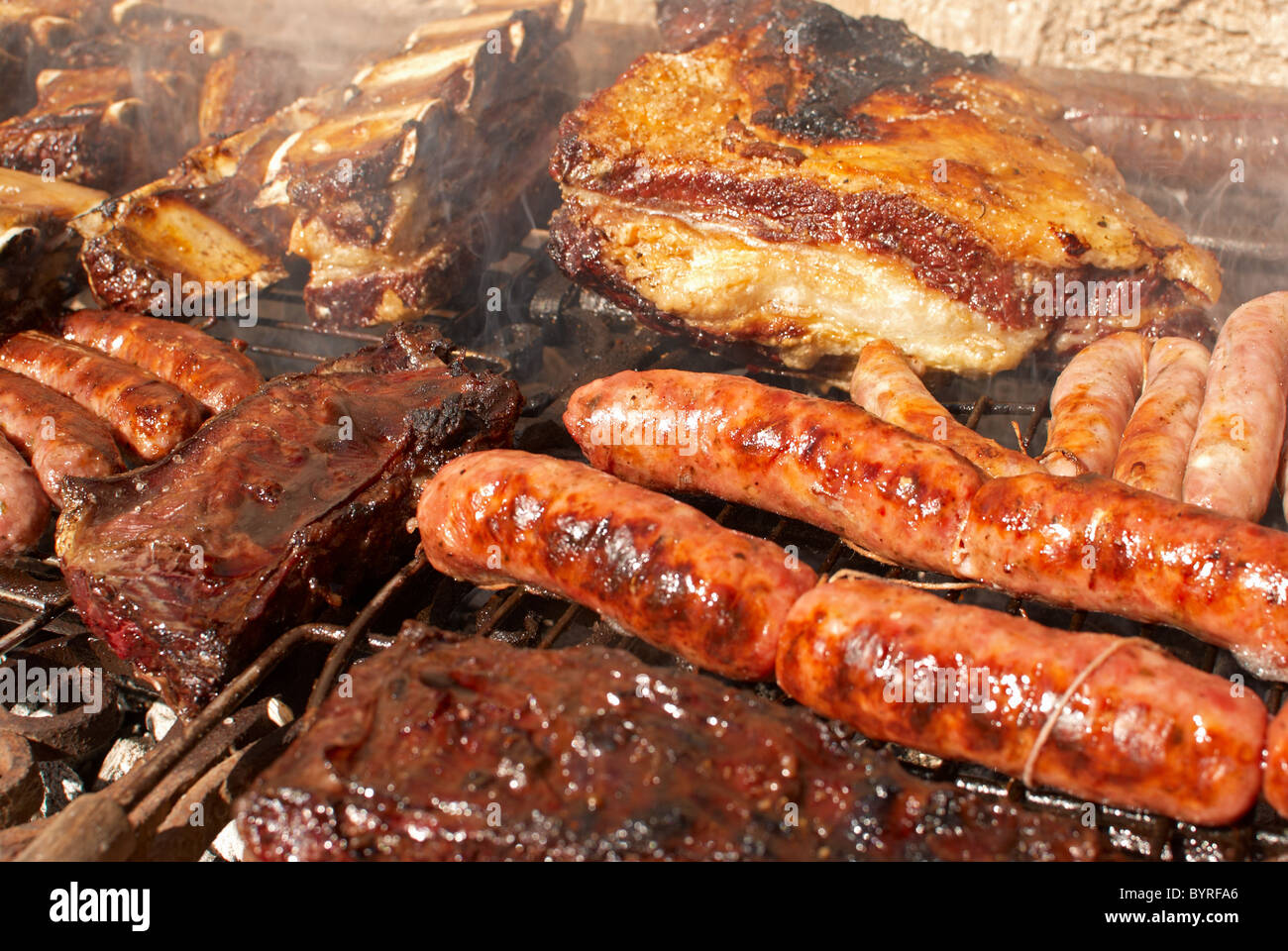 Typical Argentinian barbecue with several types of meat Stock Photo - Alamy