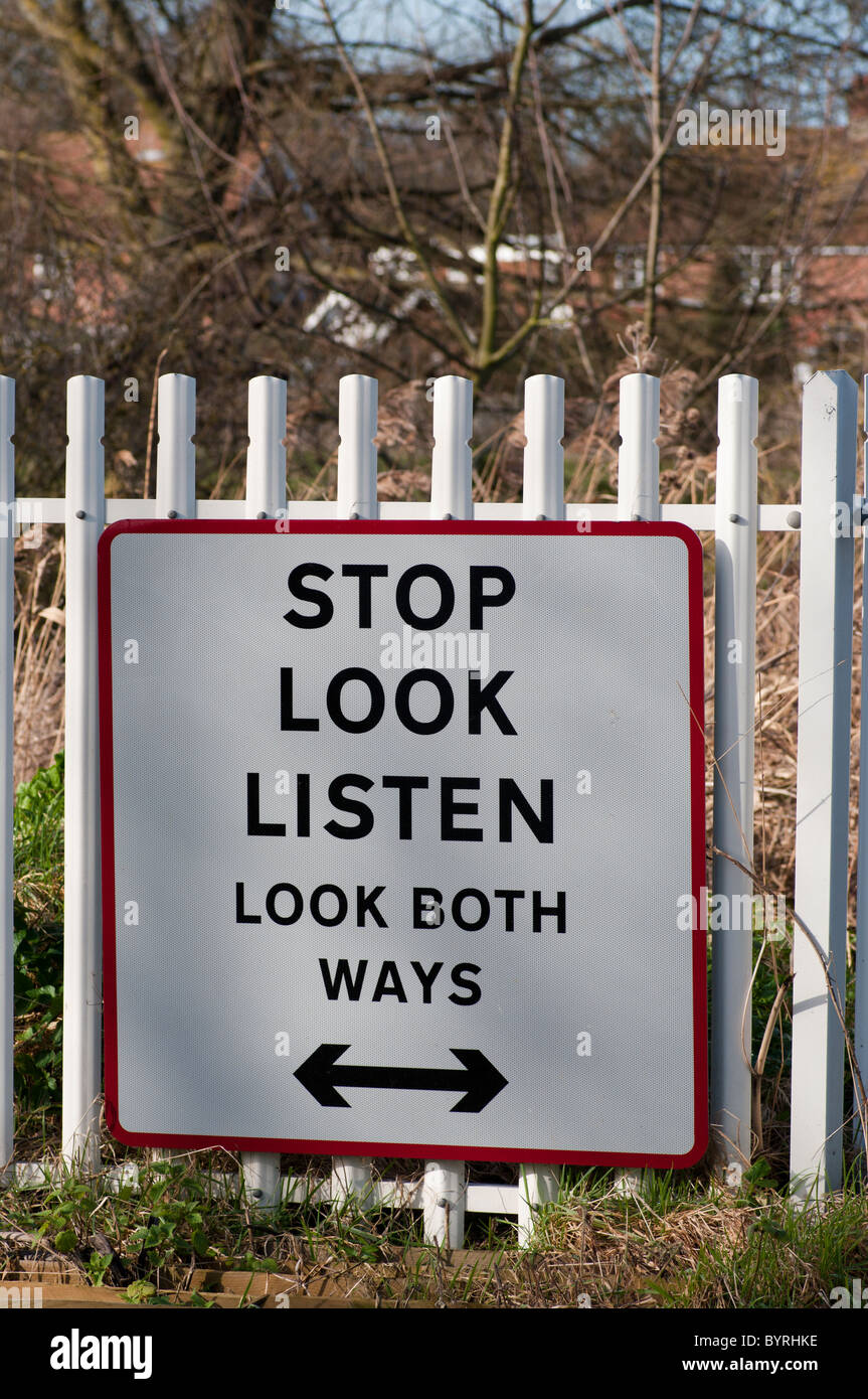Stop Look Listen Look Both Ways Sign On an Unmanned Railway Crossing ... Stop Look Listen Look Both Ways Sign On an Unmanned Railway Crossing ...
