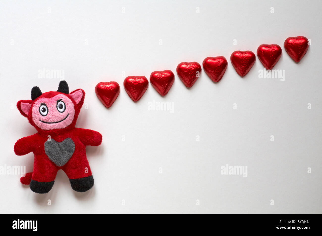 The devil loves chocolate concept - little devil soft cuddy toy with ...