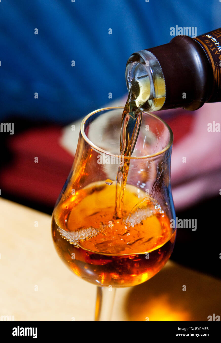 Pour up whisky in a glass.Sweden Stock Photo - Alamy