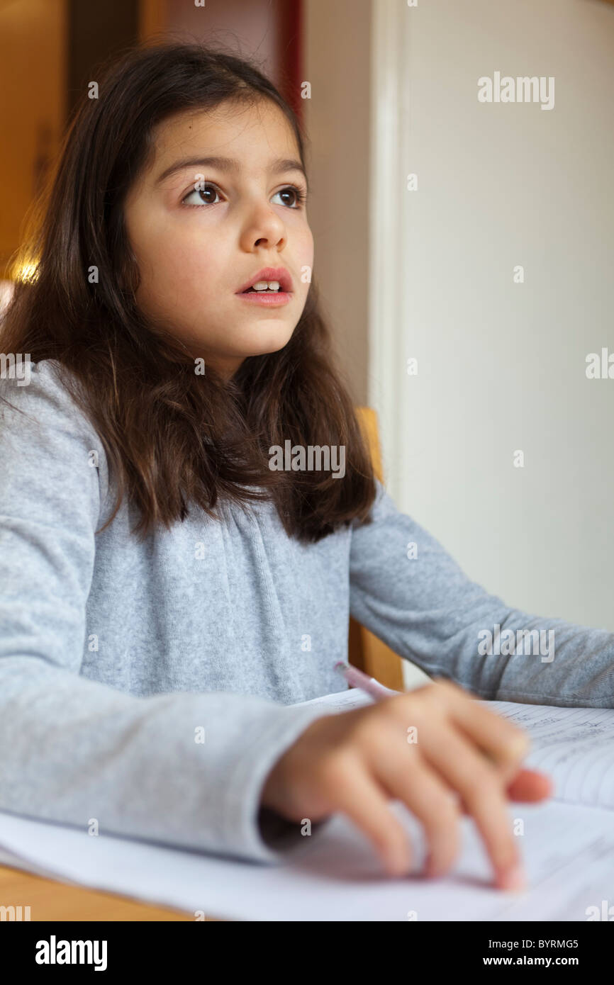 8 year old girl doing her homework Stock Photo - Alamy