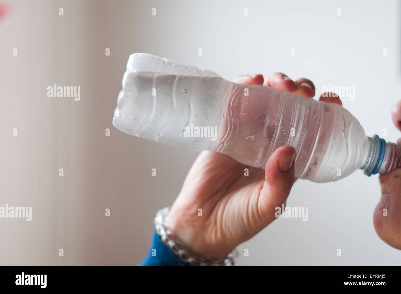 person drinking water from a plastic bottle-close-up Stock Photo - Alamy