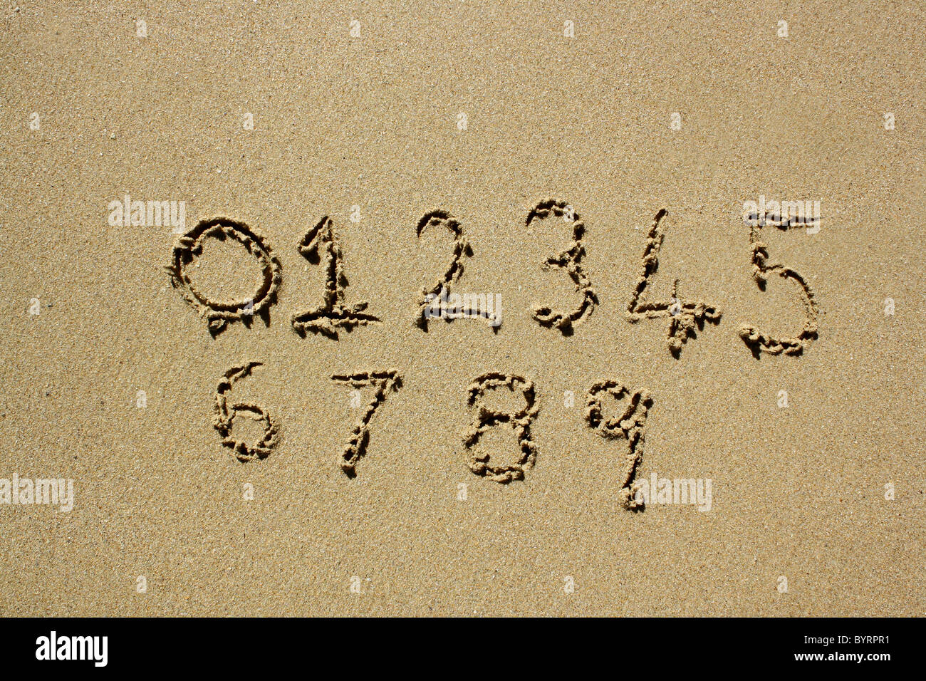 The numbers 0 - 9 written out in wet sand. Please see my collection for ...