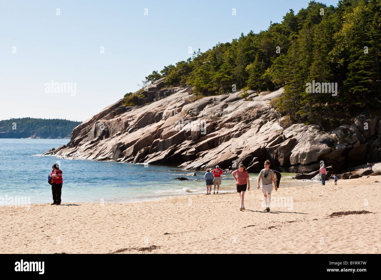 Tourists visiting Sand Beach in Acadia National Park near Bar Harbor ...