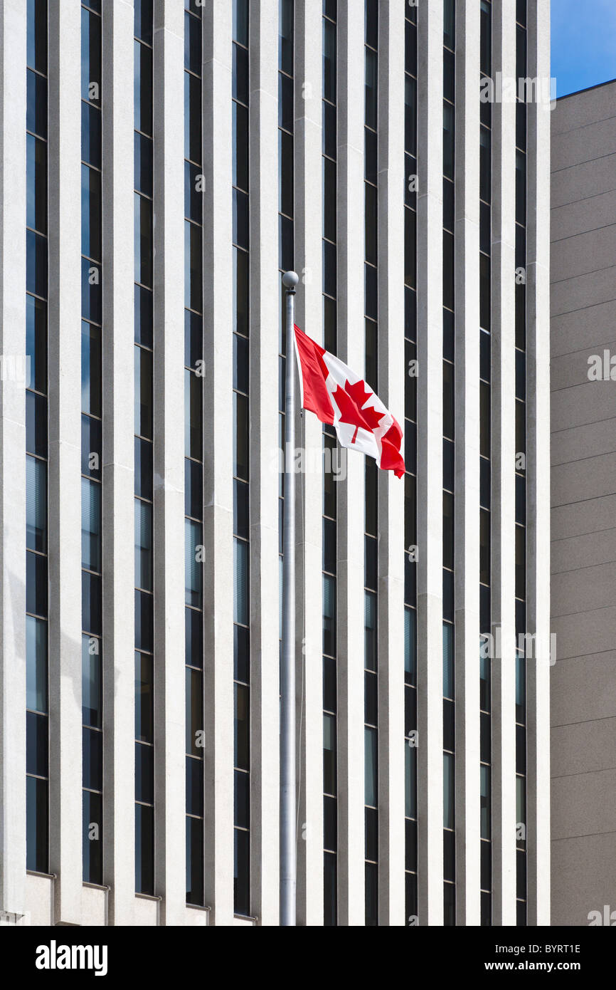 Canadian flag flying on mast outside Canada Trust bank building in ...