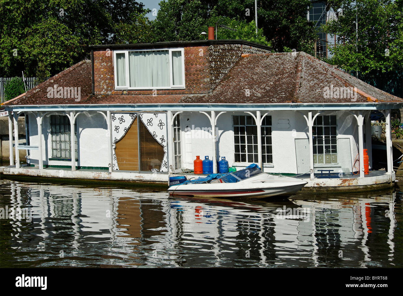 LONDON, UK - MAY 24, 2010: Houseboat on the River Thames near Kingston ...