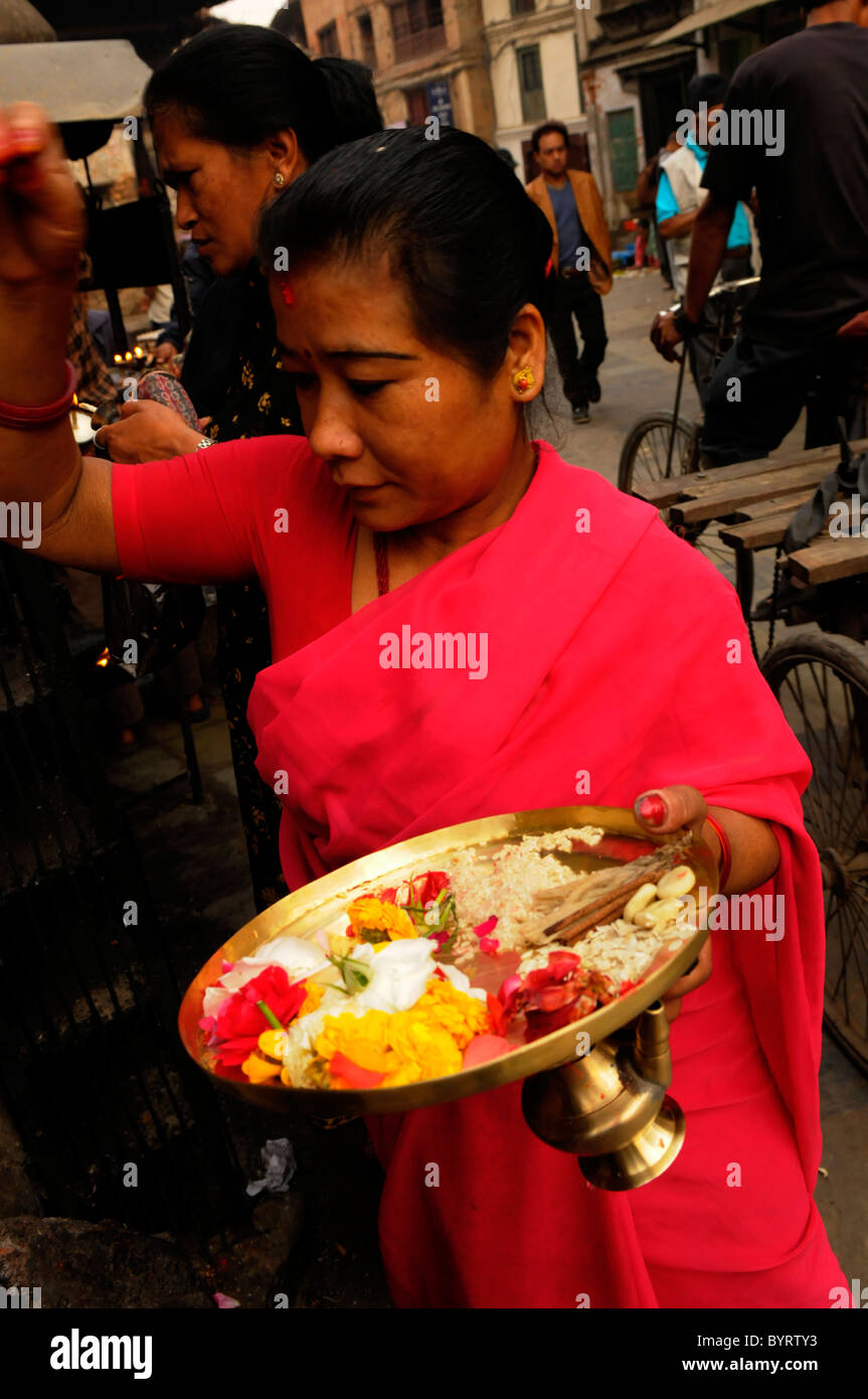 hindu lady praying at shrine , peoples lives ( the nepalis ) , life in ...