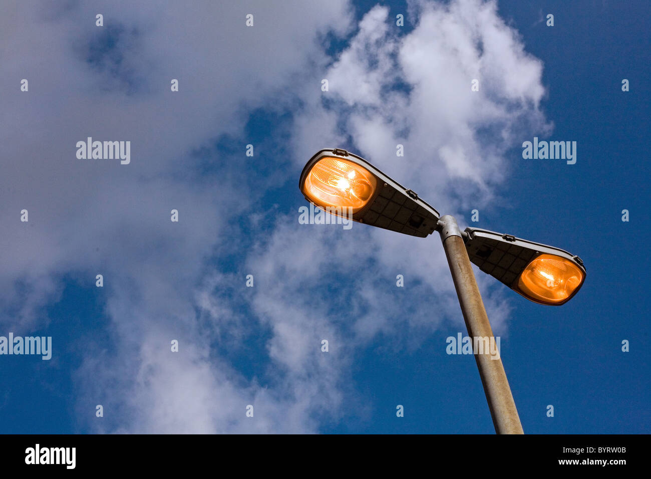 Lit streetlights in broad daylight Stock Photo - Alamy