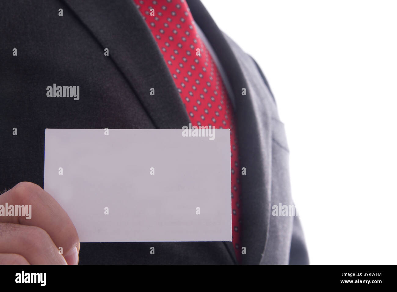 Business man in grey business suit with red power tie shows empty ...