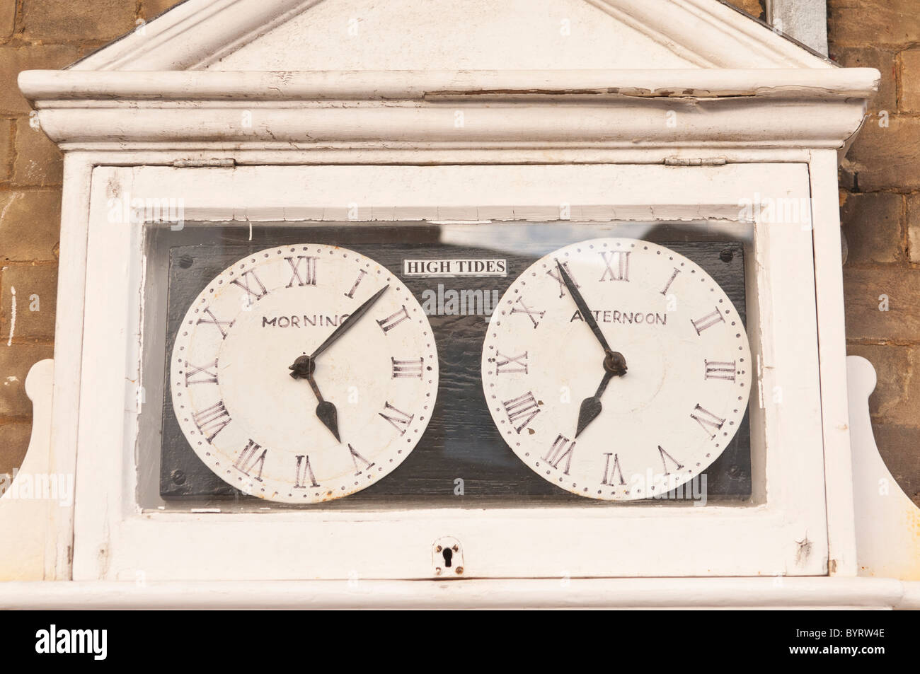 Clocks showing high tide timetables in Southwold , Suffolk , England ...