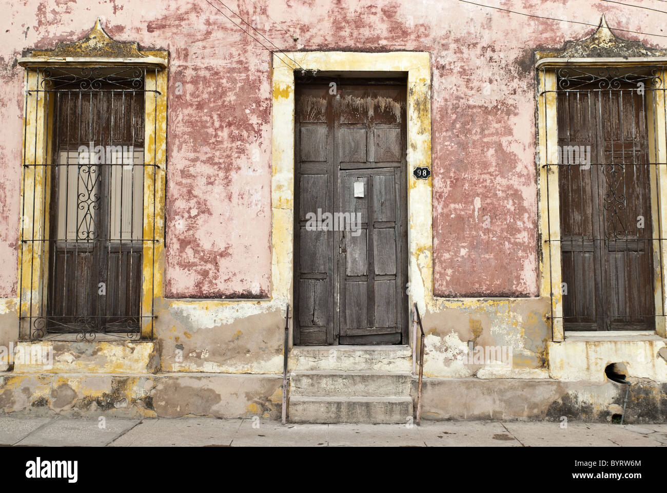 Old house with high windows in the streets of Holguin, Cuba Stock Photo ...