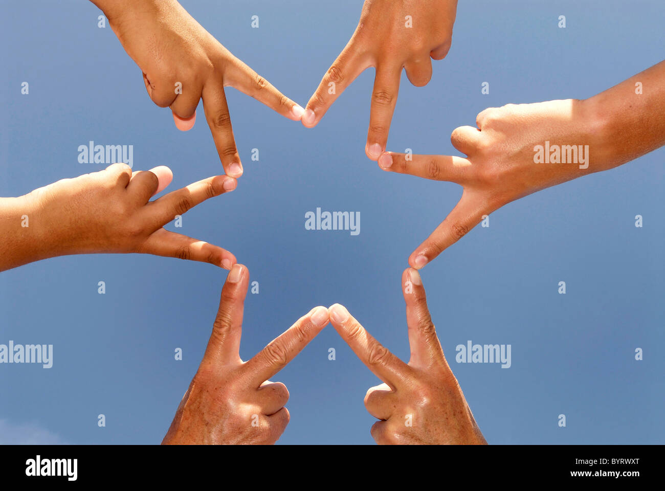 Fingers together forming a star Stock Photo - Alamy