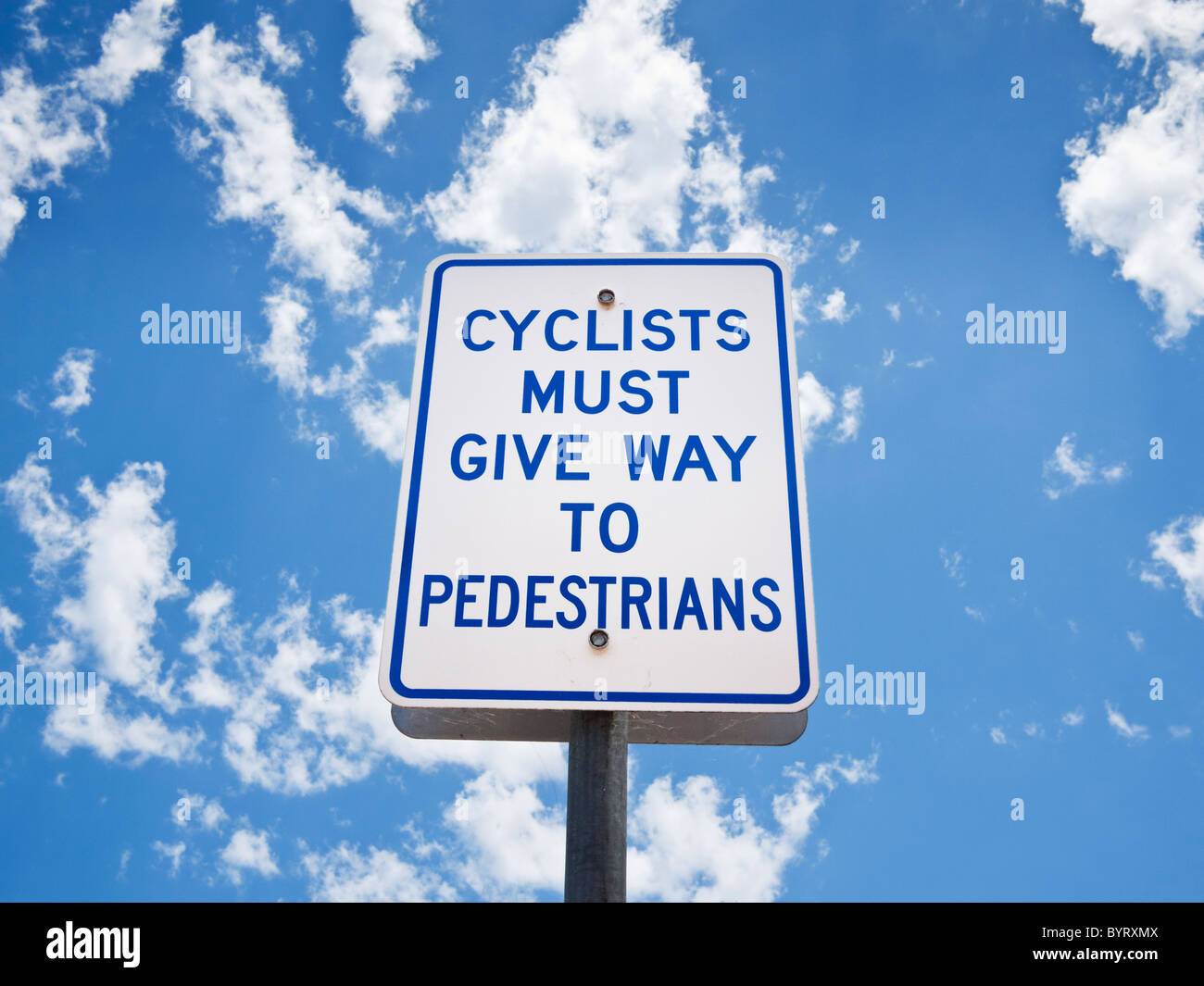 Cyclists must give way to pedestrians sign Stock Photo - Alamy