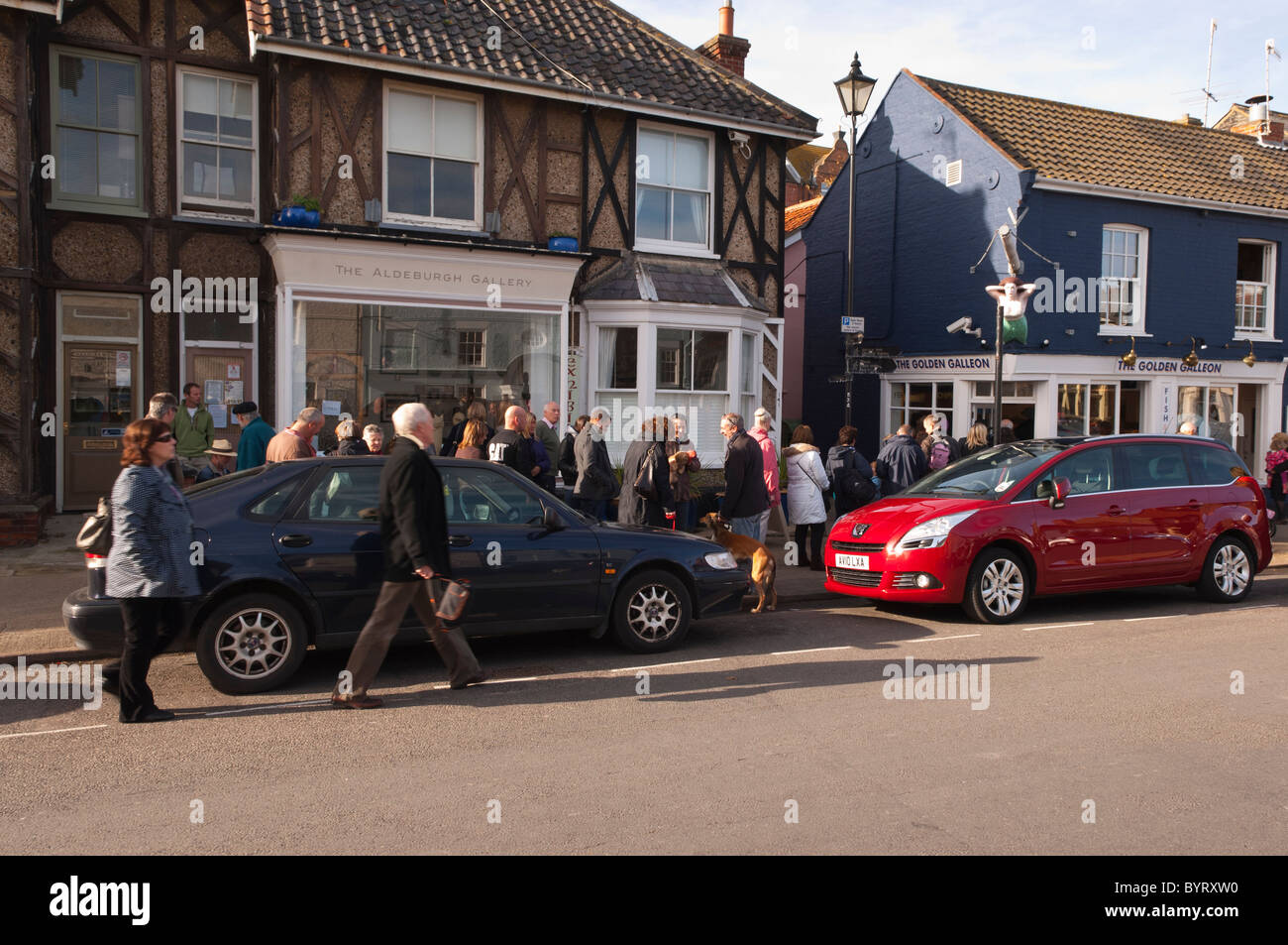 People queue outside The Golden Galleon fish and chip shop at Aldeburgh ...