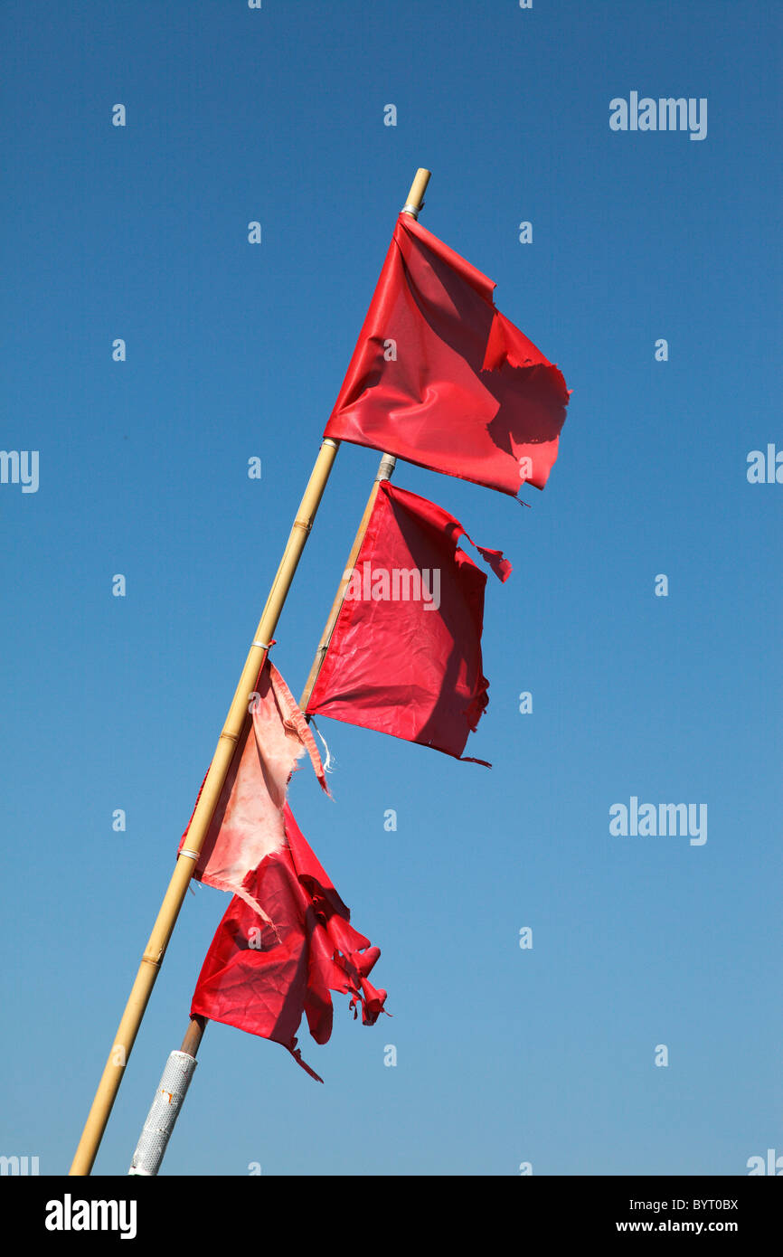 red flag before blue sky Stock Photo - Alamy